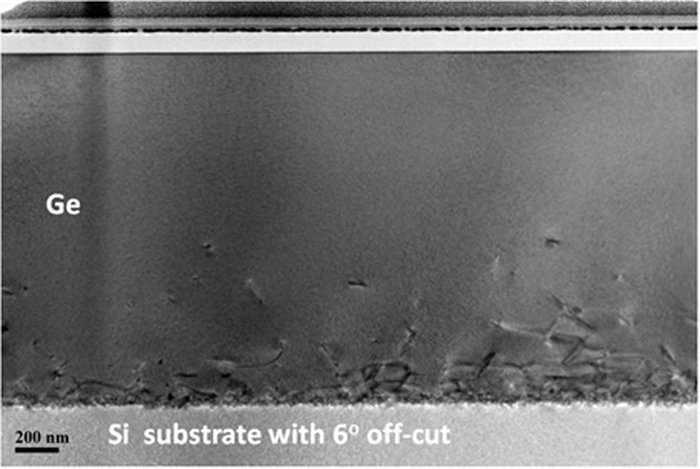 Reduction of threading dislocation density in Ge/Si using a heavily As ...
